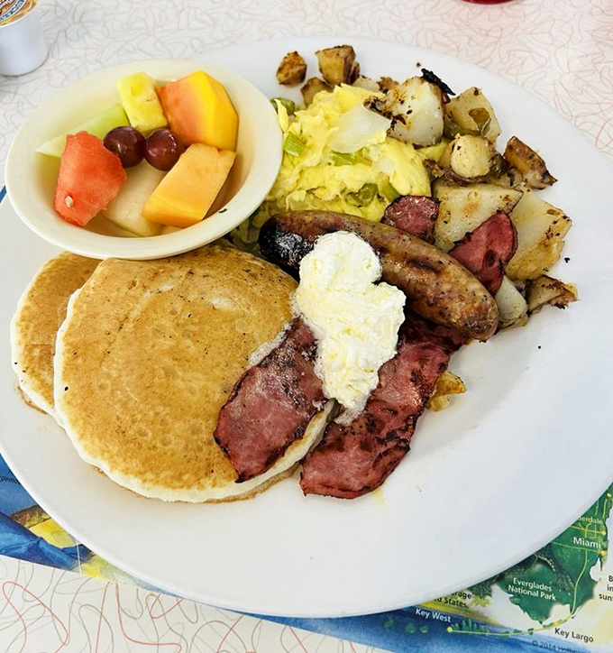 Breakfast of champions! Golden pancakes, perfectly cooked eggs, and home fries that somehow manage to be both crispy and tender—the holy trinity of diner breakfast.