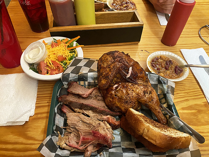 Meat trinity perfection: tender brisket, succulent chicken, and a side salad that's there to make you feel slightly virtuous.
