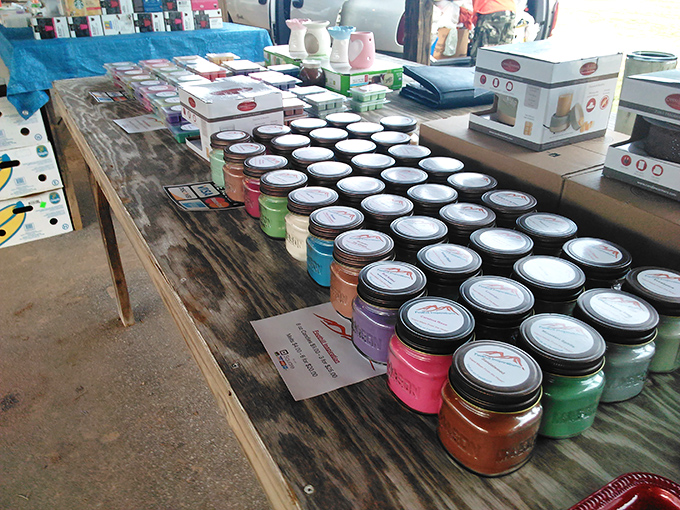 Mason jar rainbow that would make Martha Stewart swoon. Each colorful candle promises to transform your home with scents from "Grandma's Kitchen" to "Mountain Morning."