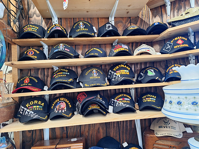 Military caps line up like soldiers at attention, each one carrying stories of service and sacrifice.