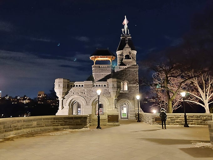 As night falls, Belvedere Castle transforms into a magical beacon. Warm lights illuminate Gothic archways, creating a scene worthy of a fantasy film.