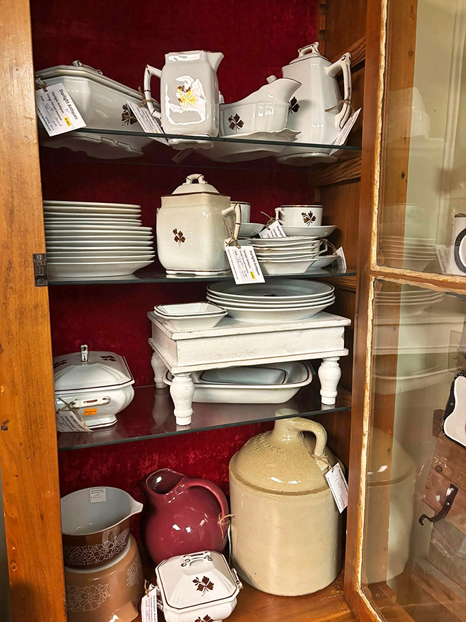 Elegant white porcelain tea sets with delicate leaf patterns wait patiently behind glass, ready to transform Sunday afternoons into Downtown Abbey-worthy occasions.