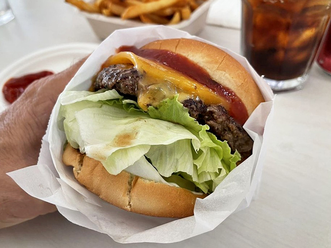 Wrapped in paper like a present to your taste buds, this cheeseburger delivers a perfect ratio of beef, cheese, lettuce, and that signature sauce.