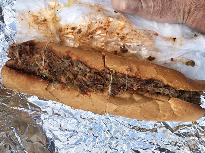 This cheesesteak isn't just a sandwich; it's a masterpiece of beef, melted cheese, and bread that demands both hands.