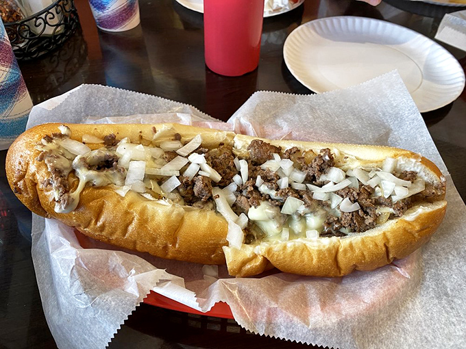 This isn't just a cheesesteak; it's a masterclass in balance—tender beef, melted cheese, and fresh onions cradled in a roll that's both sturdy and yielding.