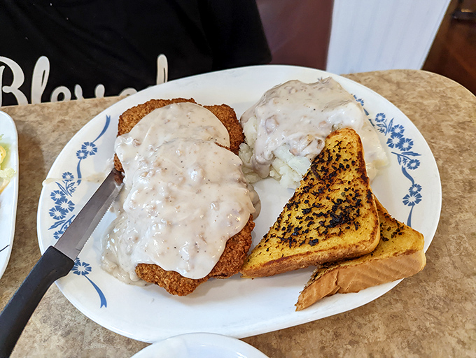 Chicken fried steak that's achieved the impossible trifecta: crispy coating that stays put, tender meat within, and gravy that deserves its own fan club.