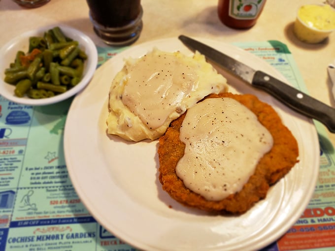 Country-fried steak smothered in gravy that could make a vegetarian question their life choices. The green beans provide the illusion of virtue.