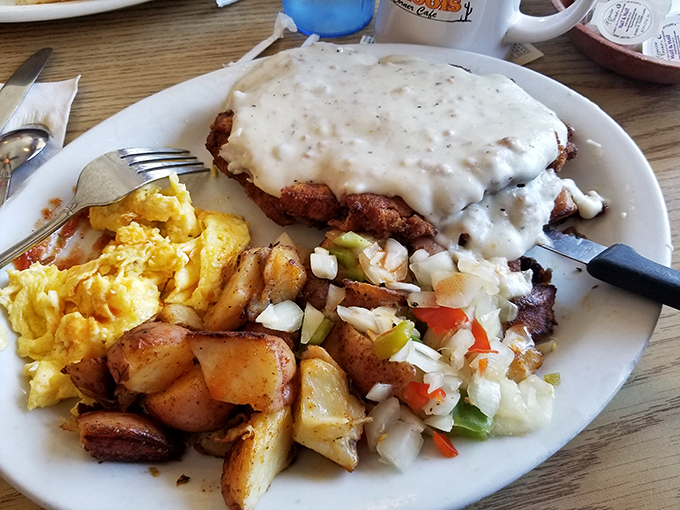 Behold the chicken fried steak in all its gravy-drenched glory&mdash;a masterpiece of comfort food that would make your cardiologist wince and your soul sing.