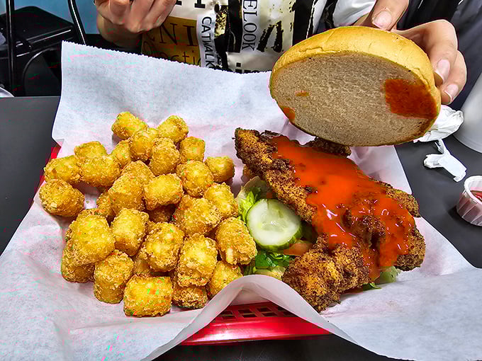 This buffalo chicken sandwich with tater tots isn't just food; it's an edible love letter to comfort. The sauce-to-crunch ratio is nothing short of mathematical perfection.