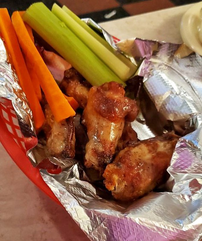 These wings aren't just good, they're "cancel-your-afternoon-plans" good. Crispy, saucy perfection served with the universal language of celery and carrots.