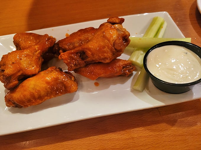 Behold the golden-crusted beauties that inspired this entire journey, served with celery that knows its supporting role and blue cheese that earns overtime.