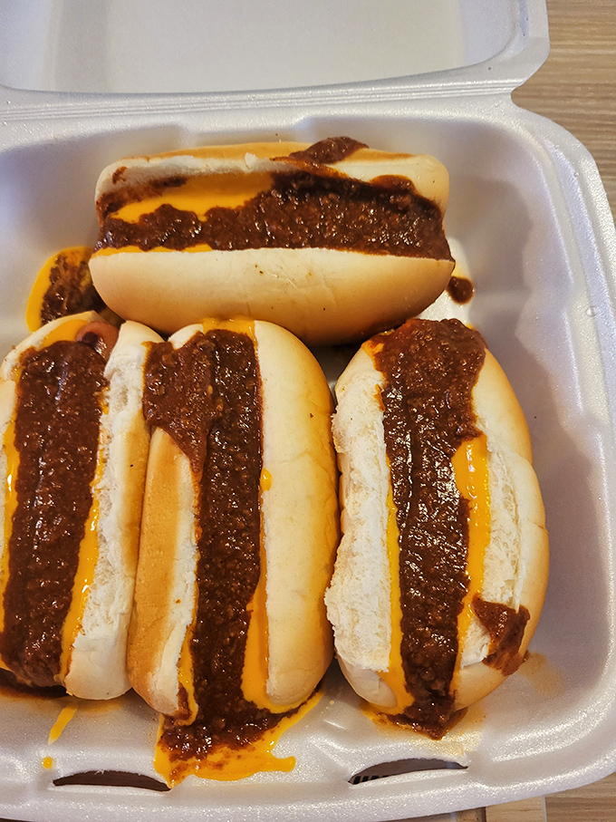 Meet the star attraction: chili cheese dogs that inspire poetry. The perfect snap of the frank, the warm embrace of homestyle chili, the gooey cheese&mdash;it's edible harmony.