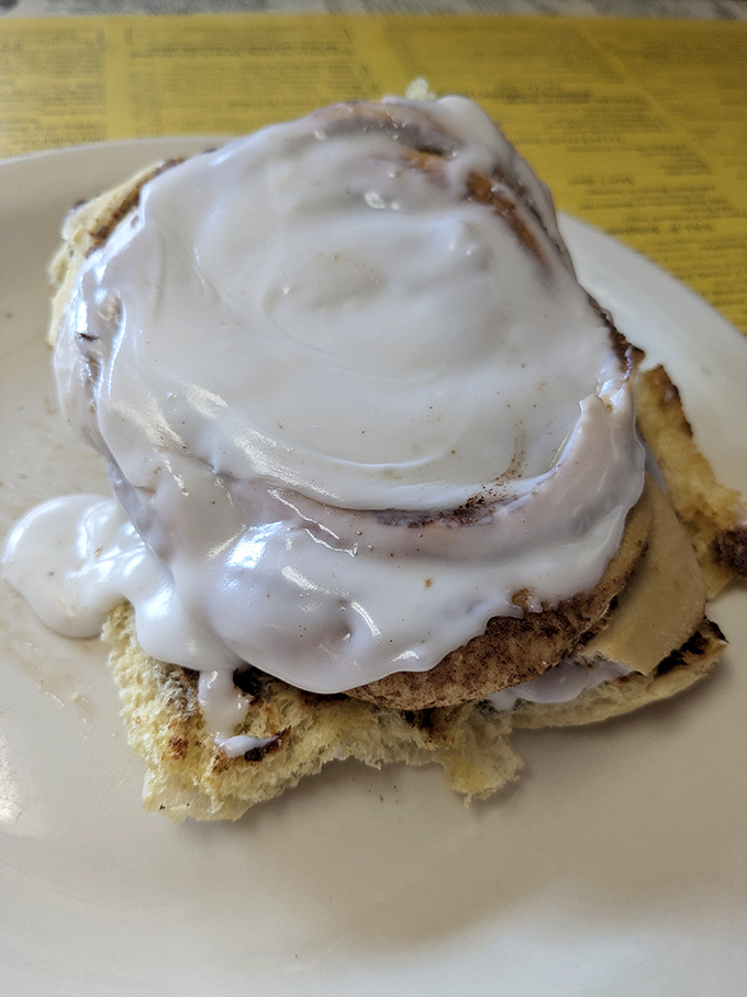 The star of the show &ndash; a cinnamon roll that doesn't just satisfy hunger but creates memories. That frosting river would make the Mississippi jealous.