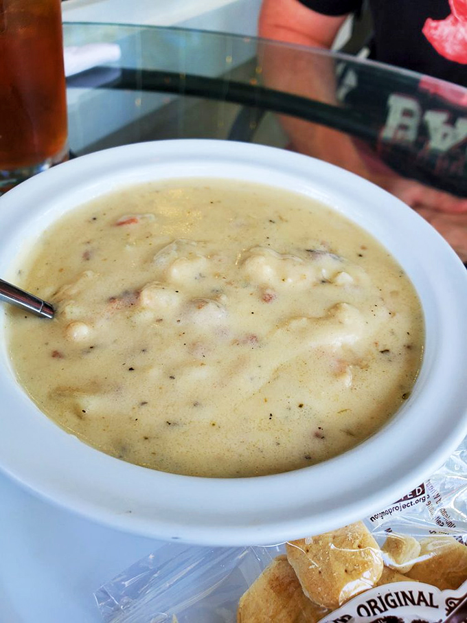 Liquid gold in a bowl &ndash; this creamy New England clam chowder isn't just soup, it's a warm embrace from the North Atlantic itself.