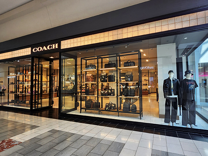Coach's sleek storefront displays leather temptations that whisper, "You deserve me," while mannequins model how to pull off that splurge with confidence.