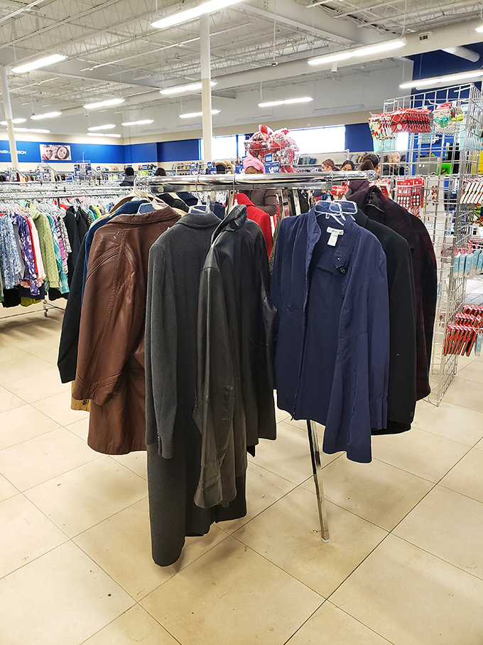 The men's coat section, where vintage leather jackets and barely-worn blazers wait patiently for their second act on someone else's shoulders.