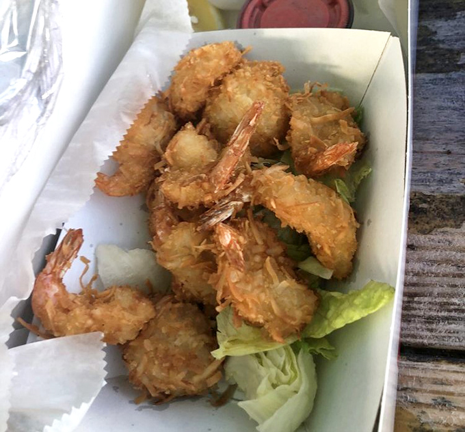 Golden treasures from the Gulf. These coconut shrimp aren't just fried&mdash;they're transformed into crispy, sweet morsels that might make you forget your table manners.