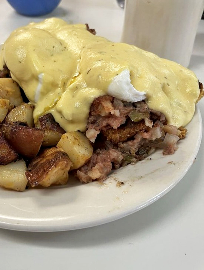 This isn't just corned beef hash &ndash; it's a mountain range of savory goodness with poached egg peaks and hollandaise lava flows. Explorers, bring your appetite.