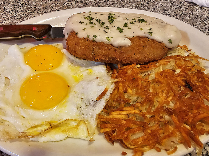 Sunny-side perfection meets golden hash browns. This country-fried steak breakfast is the morning equivalent of winning the lottery.