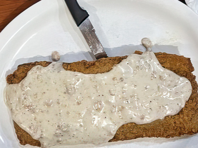 The star of the show: country fried steak bathed in peppery gravy. Vegetarians, avert your eyes&mdash;this is carnivore territory at its finest.