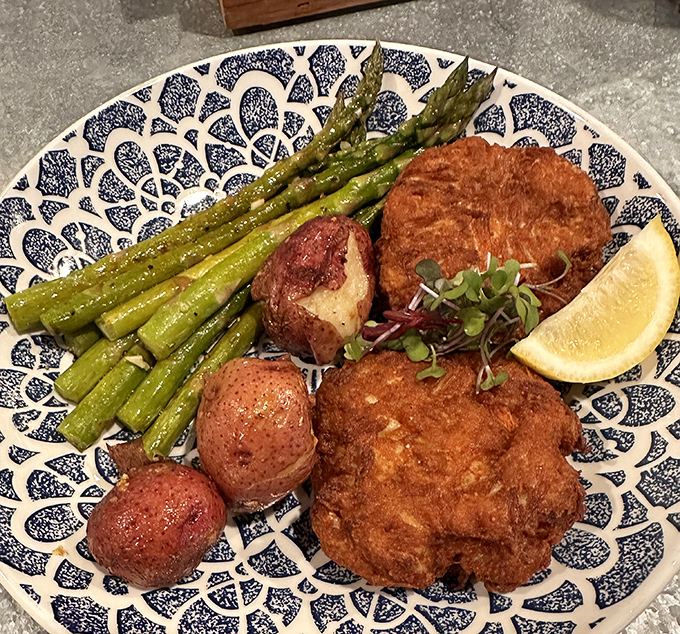 Not all heroes wear capes; some wear golden-brown crusts. JP's crab cake arrives with perfectly roasted potatoes and asparagus&mdash;a trio that belongs together like The Three Tenors.