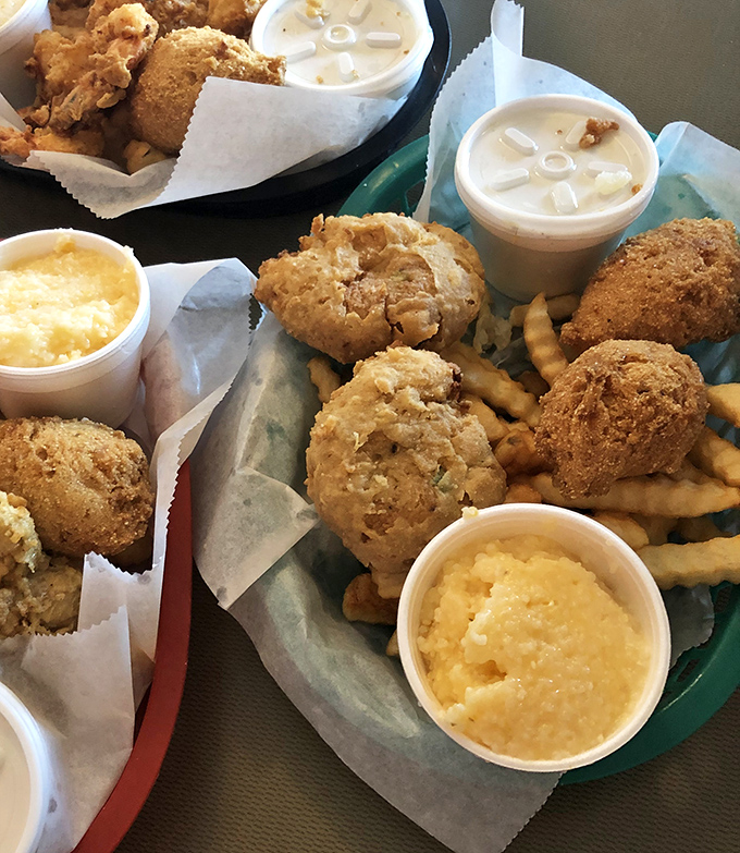 Golden-brown crab cakes that could make a mermaid weep with joy, paired with creamy cheese grits that might just change your definition of comfort food.