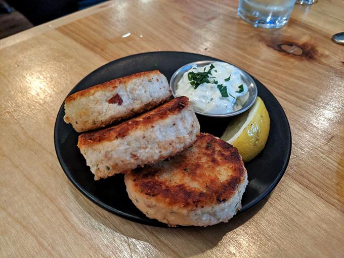 These golden-brown seafood cakes aren't just cooked, they're respected. Crispy exterior, tender inside &ndash; the seafood equivalent of a perfect hug.