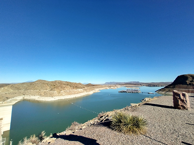 Engineering marvel meets natural splendor. The dam that created this desert paradise stands as proudly as a contestant on The Great British Bake Off. 