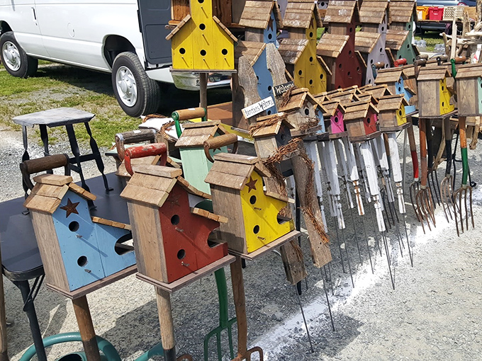 Colorful birdhouses line this vendor's display, each one a cheerful testament to the handcrafted treasures waiting to be discovered at Jake's.