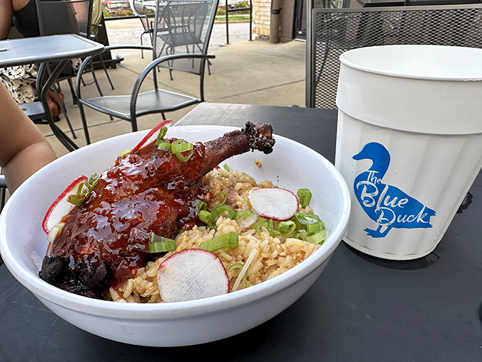 This isn't just duck fried rice; it's a religious experience in a bowl, complete with that glistening duck leg beckoning you.