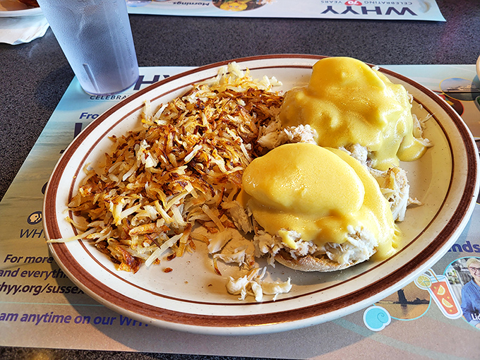 Eggs Benedict that would make a food photographer weep. Golden hollandaise cascading over perfectly poached eggs with hash browns crisped to perfection.