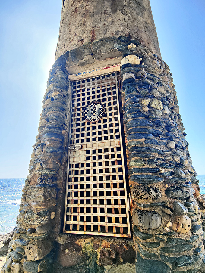 The tower's entrance, complete with medieval-style grate, practically begs you to imagine what treasures might be hidden inside.