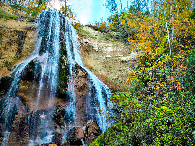 Smith Falls in autumn glory, where 70 feet of cascading water meets a painter's palette of fall colors.