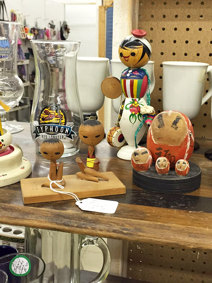 Vintage wooden figurines and collectible glassware stand at attention, silent witnesses to decades of changing tastes and design trends.