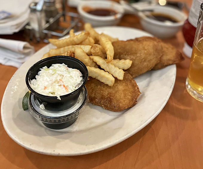 Golden-battered fish that shatters with each bite, alongside fries that achieve the perfect crisp-to-fluffy ratio. This isn't just dinner&mdash;it's edible therapy.