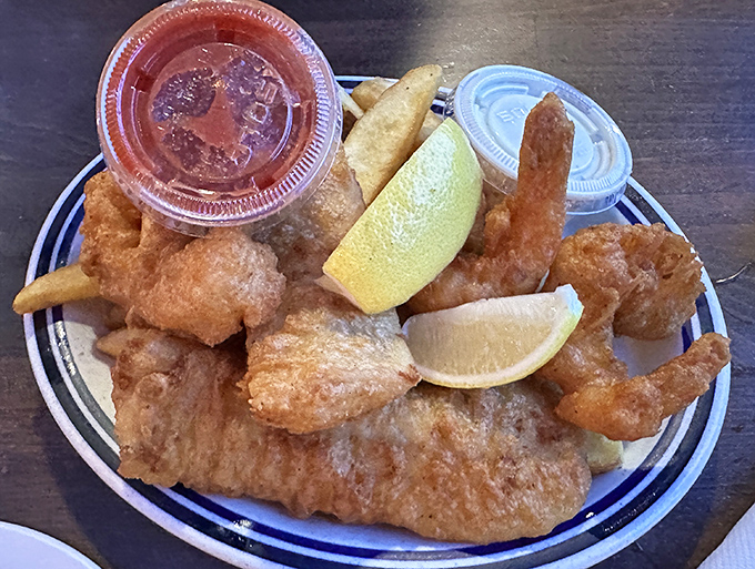 This isn't just fish and chips; it's edible sunshine—golden-battered cod with crispy fries that might just ruin you for all other versions forever.