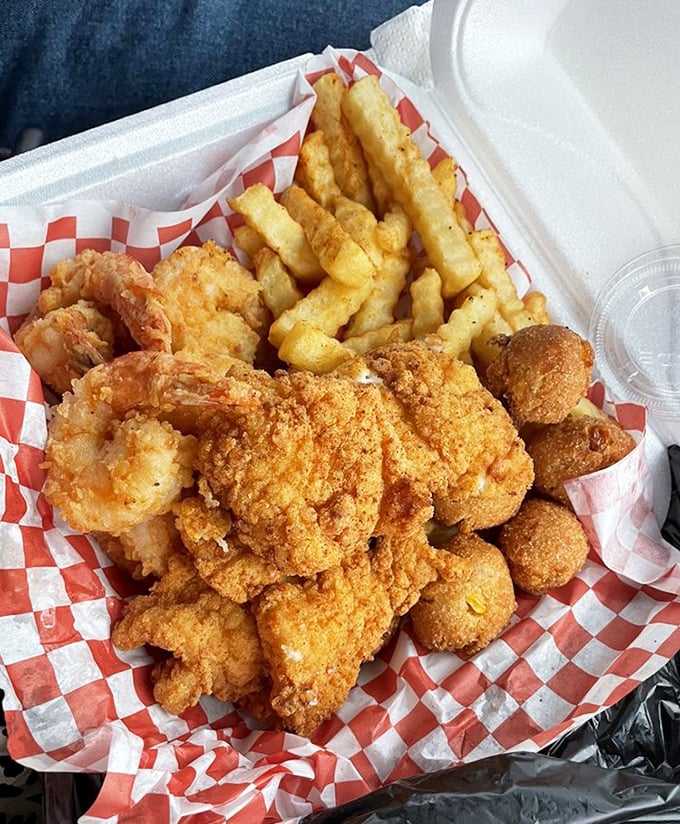 Fried to golden perfection, this seafood basket doesn't just feed you&mdash;it hugs your soul. The crinkle-cut fries are merely supporting actors to the star shellfish. 