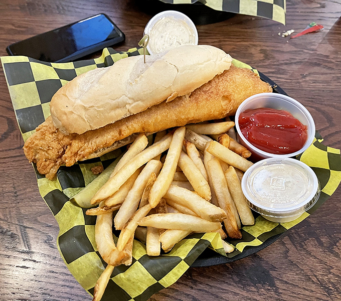 Behold the star of the show! This golden-fried fish sandwich with crispy fries isn't just a meal&mdash;it's the reason cyclists pedal extra miles.