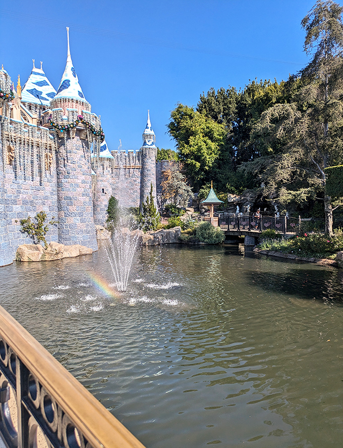 The castle moat reflects centuries of fairy tales, while a rainbow dances in the fountain spray&mdash;nature's own special effect.