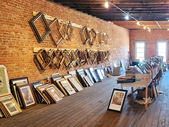 An entire wall of empty frames waiting for your memories, arranged like a geometric art installation that accidentally became genius.