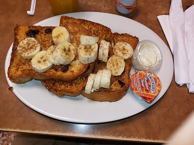 French toast that makes you question all other breakfasts you've ever had. Those bananas and cinnamon? Pure morning magic.