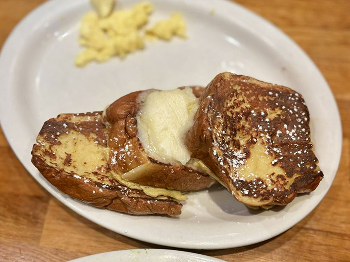 French toast that's had a Hawaiian vacation. These golden slices of sweetbread look like they're auditioning for the breakfast hall of fame.