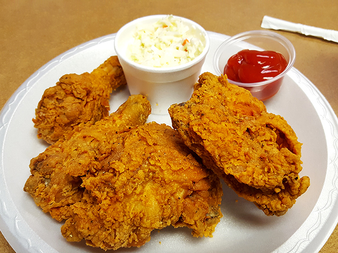 Golden perfection on a plate. This isn't just fried chicken; it's edible architecture with a PhD in crispiness and a soul of juicy tenderness.