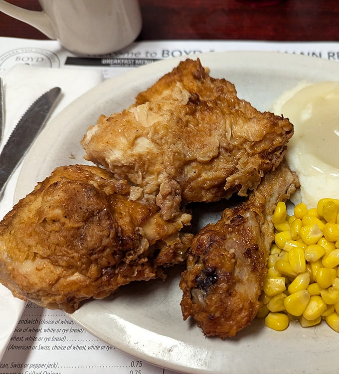 Fried chicken that makes Colonel Sanders look like an amateur. Golden, crackling skin protecting juicy meat that practically jumps off the bone.