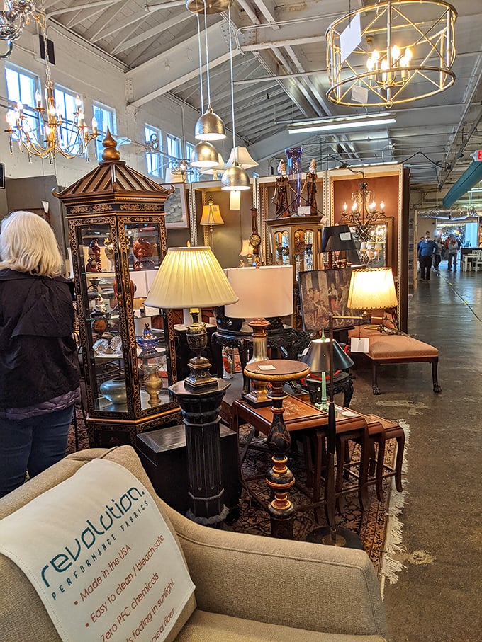 Lampshades and chandeliers create islands of warm light in this sea of furniture finds. Somewhere, a decorator is having heart palpitations.