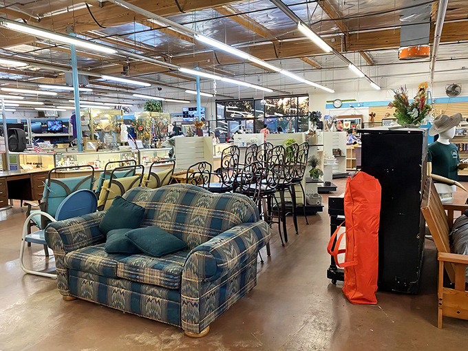 The furniture section - where that plaid loveseat might have witnessed conversations from three decades ago but still has stories to tell.