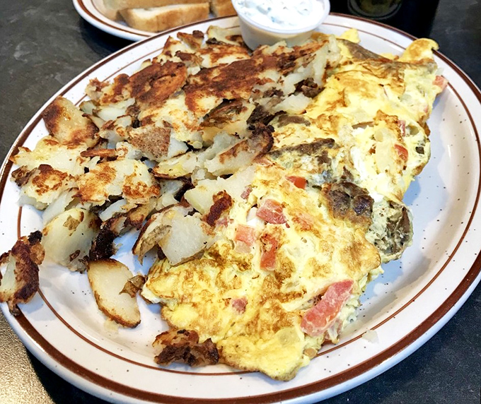 Breakfast alchemy at its finest&mdash;golden eggs cradling savory fillings alongside perfectly crisped potatoes. The breakfast of champions who aren't training for anything.