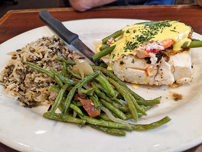 The Halibut Oscar isn't just dinner; it's a celebration on a plate. Flaky fish crowned with king crab and hollandaise&mdash;Alaska's royal family reunion.