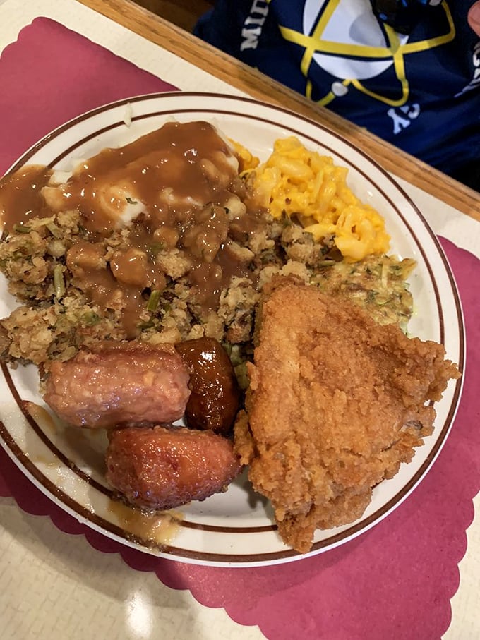 Behold: the plate that launched a thousand food comas. That golden-brown fried chicken could make Colonel Sanders weep with envy.