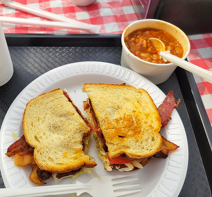 This isn't just a sandwich; it's a masterclass in comfort food architecture, with that perfectly toasted bread and a side of Brunswick stew that means business.